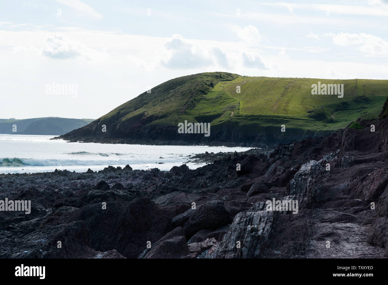 Manorbier Castle and Monarbier Bay with coast path, Pembrokeshire ...