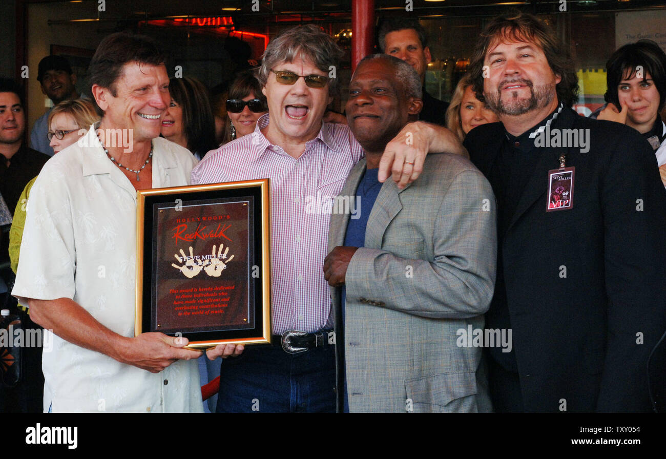Veteran rock musician Steve Miller (2nd L) poses with members of his ...