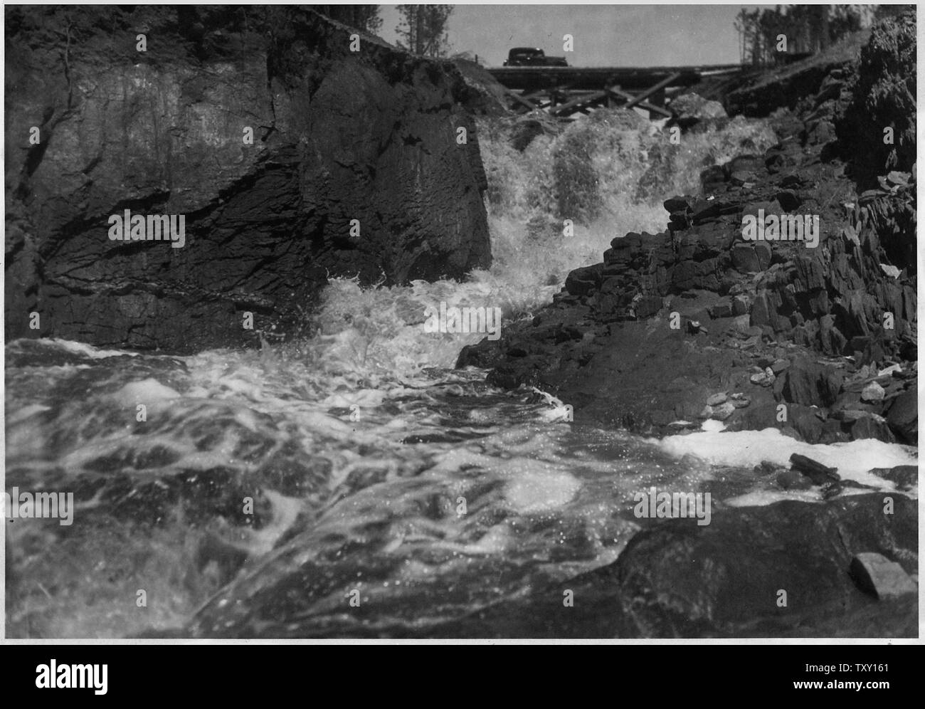 Car crossing bridge over waterfall Stock Photo - Alamy