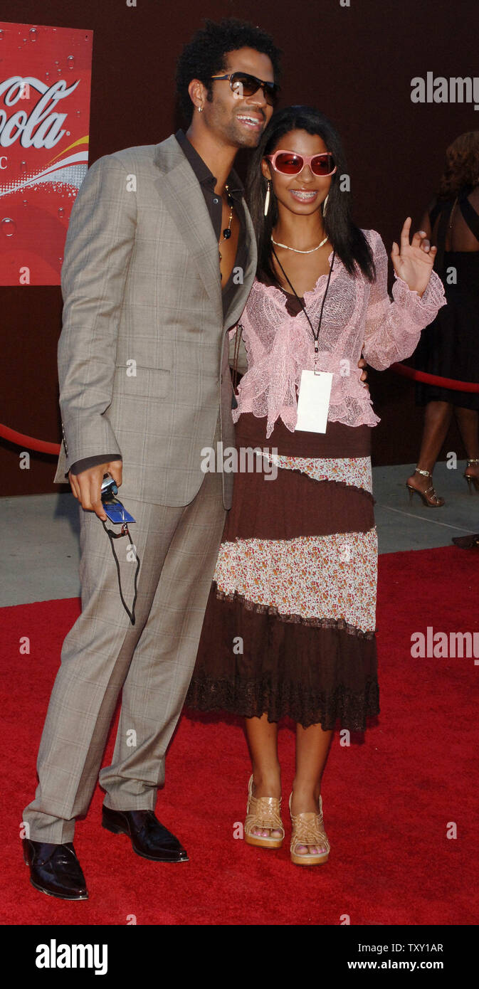 Singer Eric Benet and daughter India pose as they arrive at the tenth ...