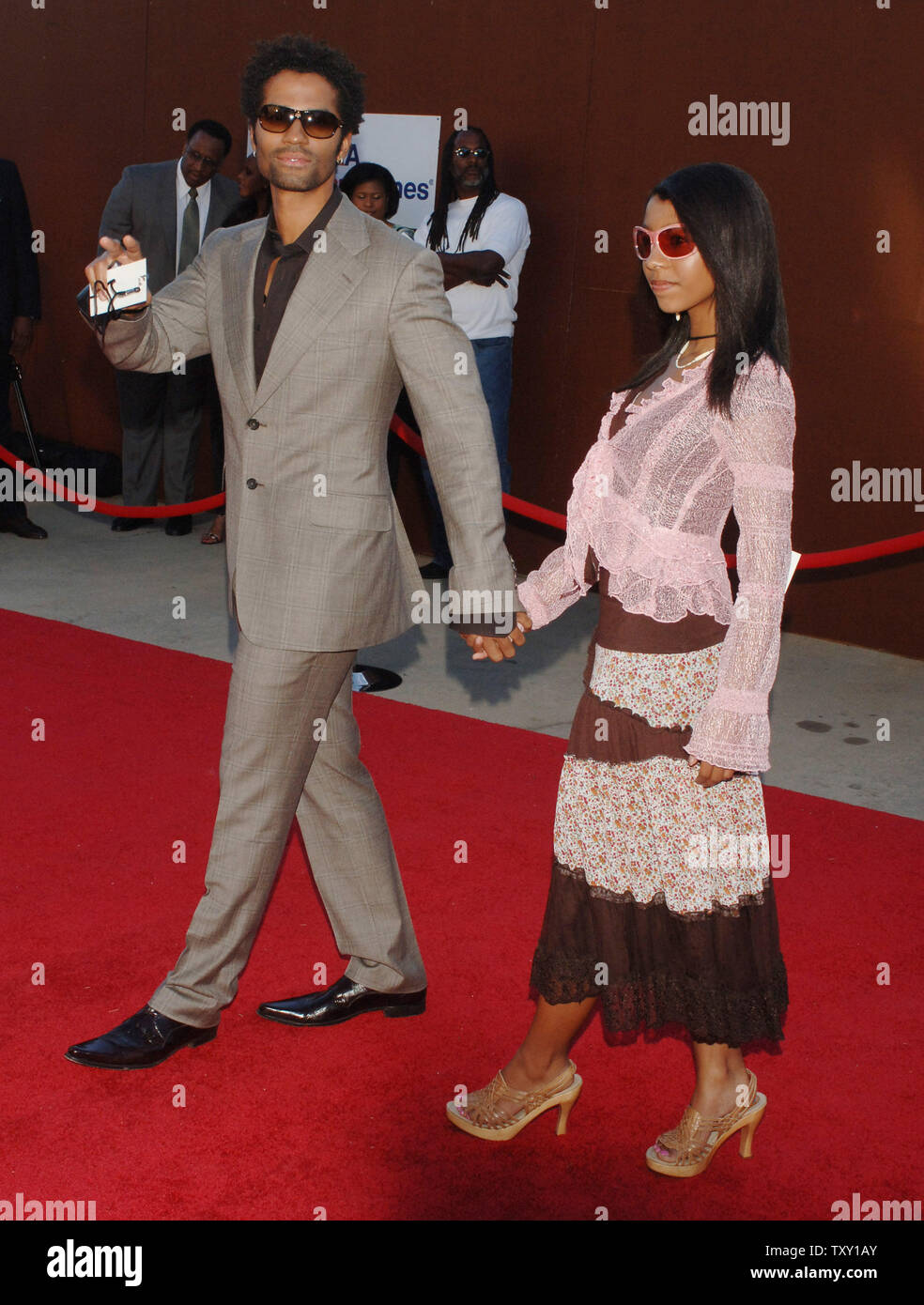 Singer Eric Benet and daughter India pose as they arrive at the tenth ...