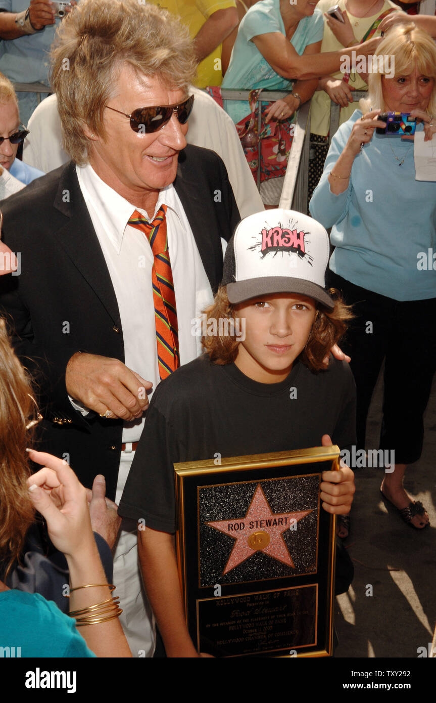 British rocker Rod Stewart (L) and his son Liam McAlister (holding ...
