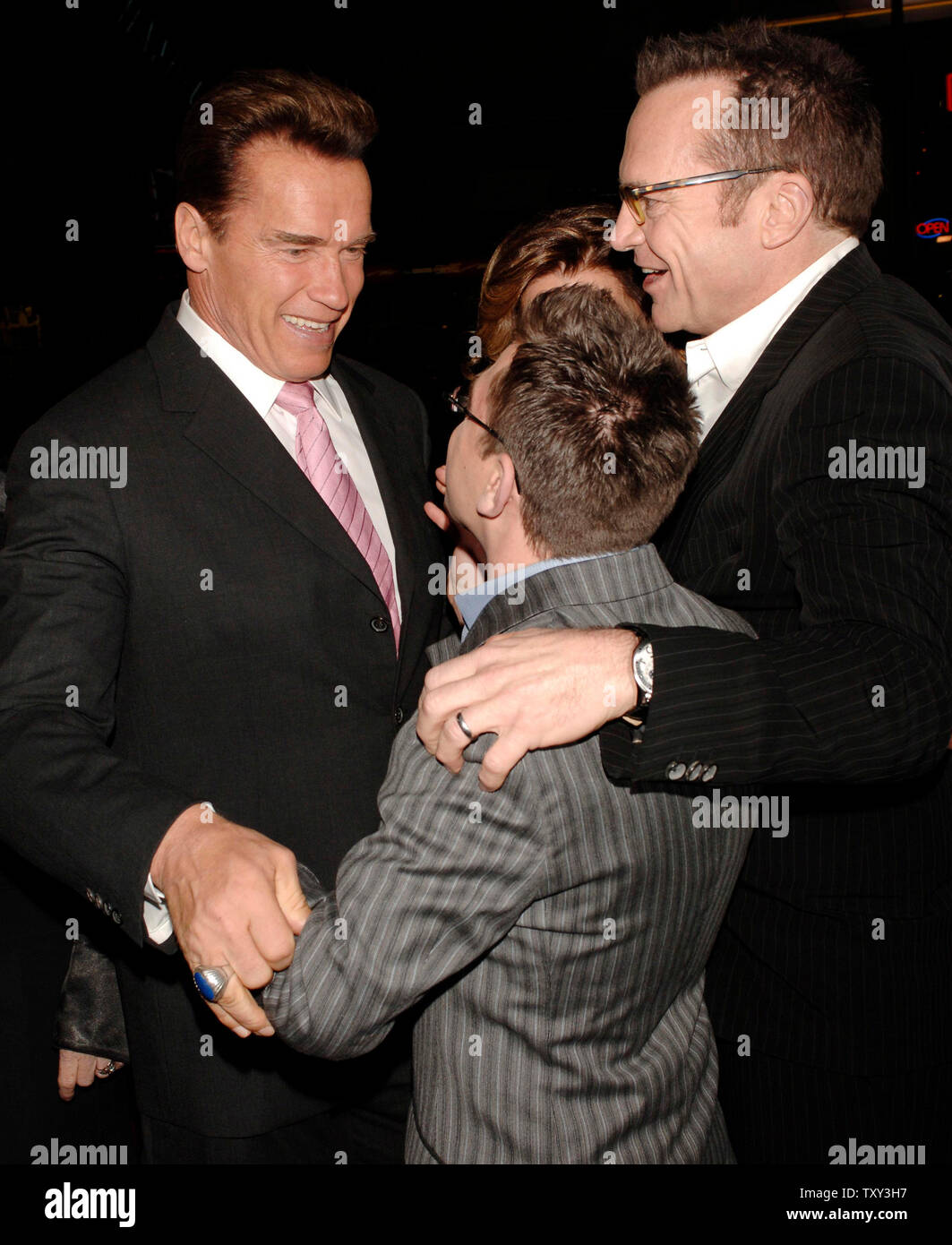 California Governor Arnold Schwarzenegger is greeted by fellow cast ...