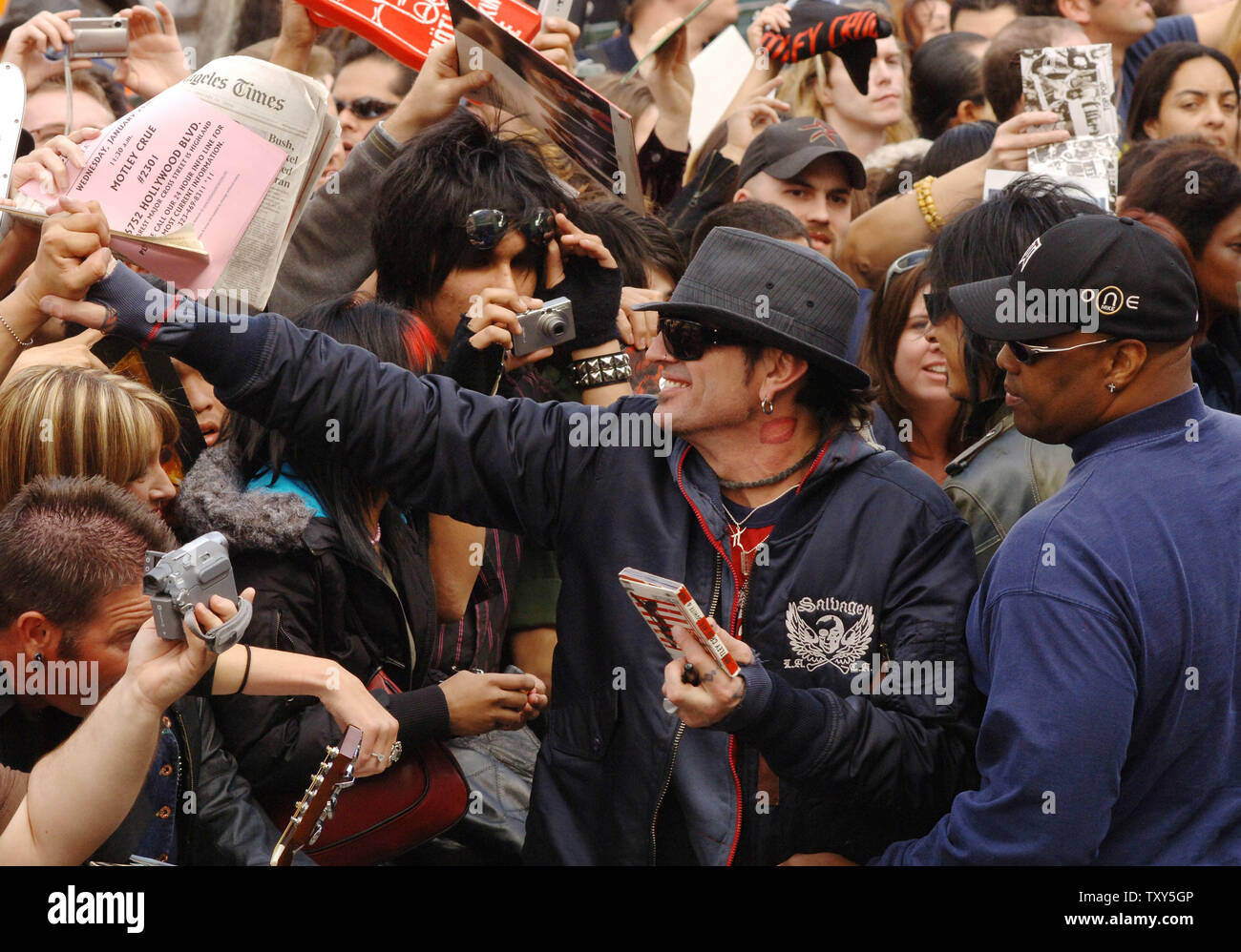 Tommy Lee, one of the members of the rock group Motley Crue, celebrates ...