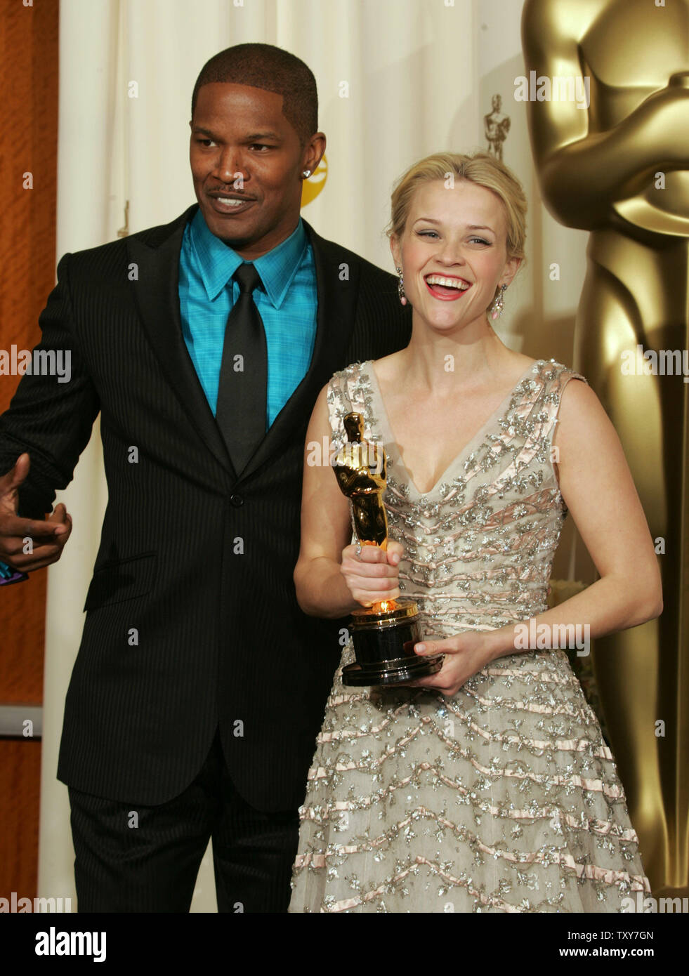 Actor Jamie Foxx poses with Reese Witherspoon who won Best Actress for ...