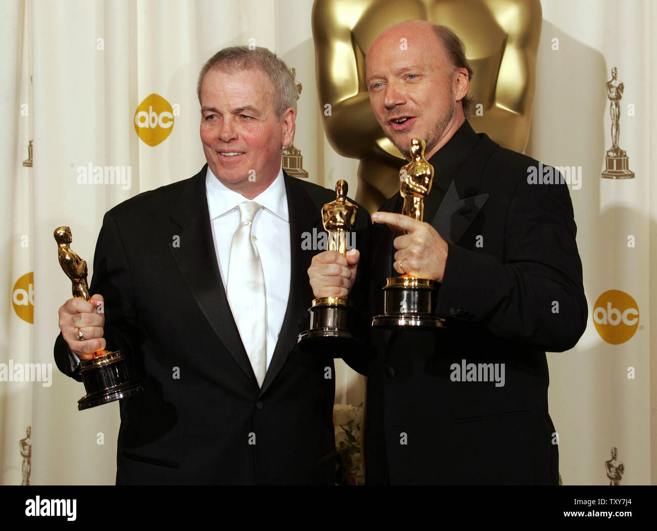 Paul Haggis and Bobby Moresco pose with their Oscars for best ...