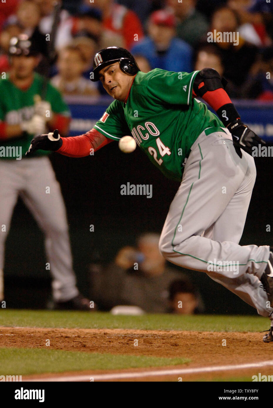 Mexico #24 Geronimo Gil watches his hit roll foul in the seventh inning ...
