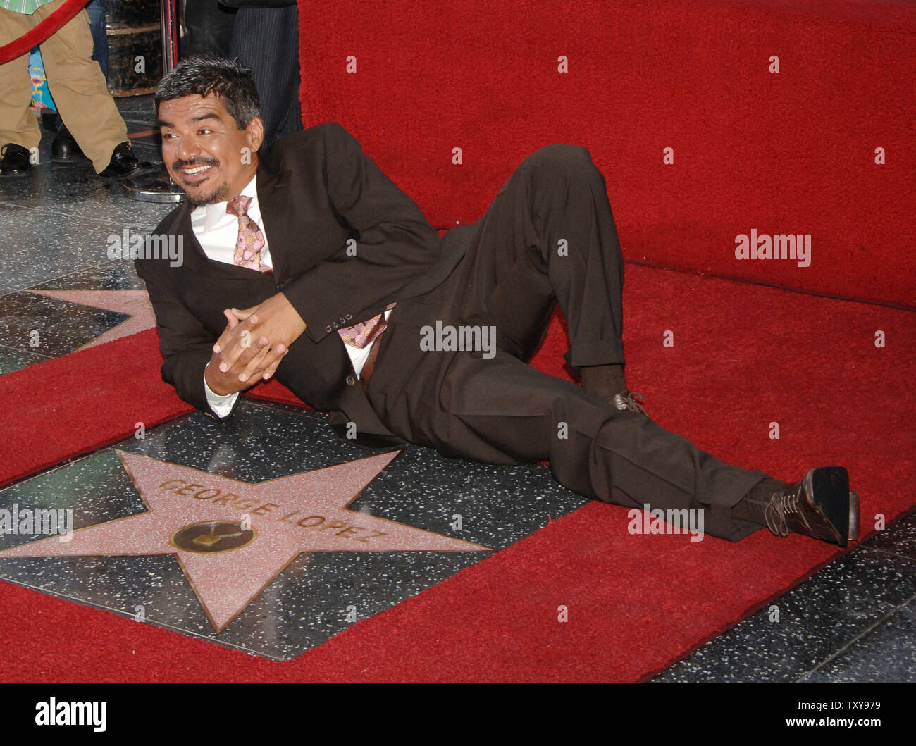 Actor and comedian George Lopez strikes a pose with his new star on the ...