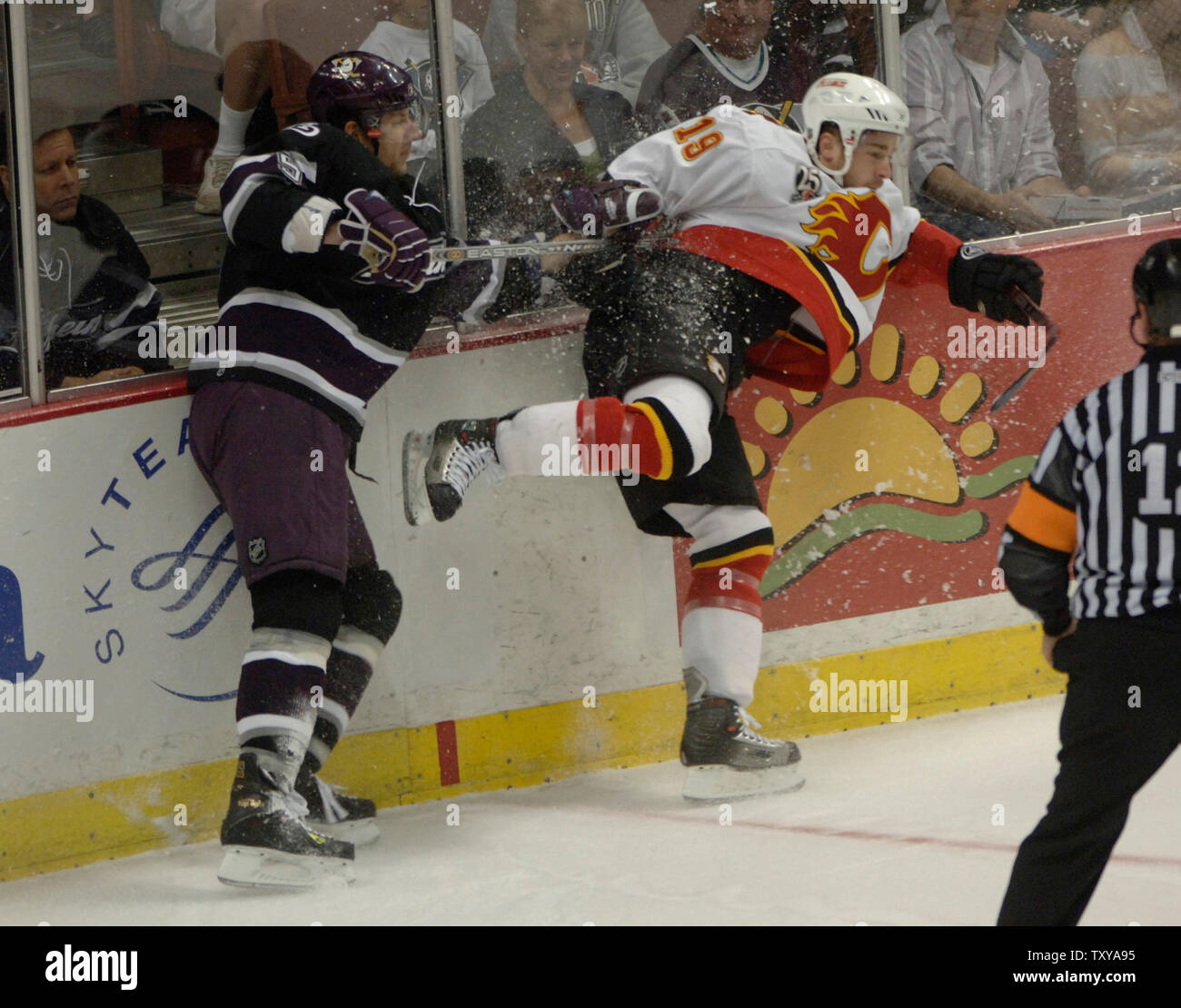 Flames Chuck Kobasew (R) and Mighty Ducks Vitaly Vishnevski collide in ...
