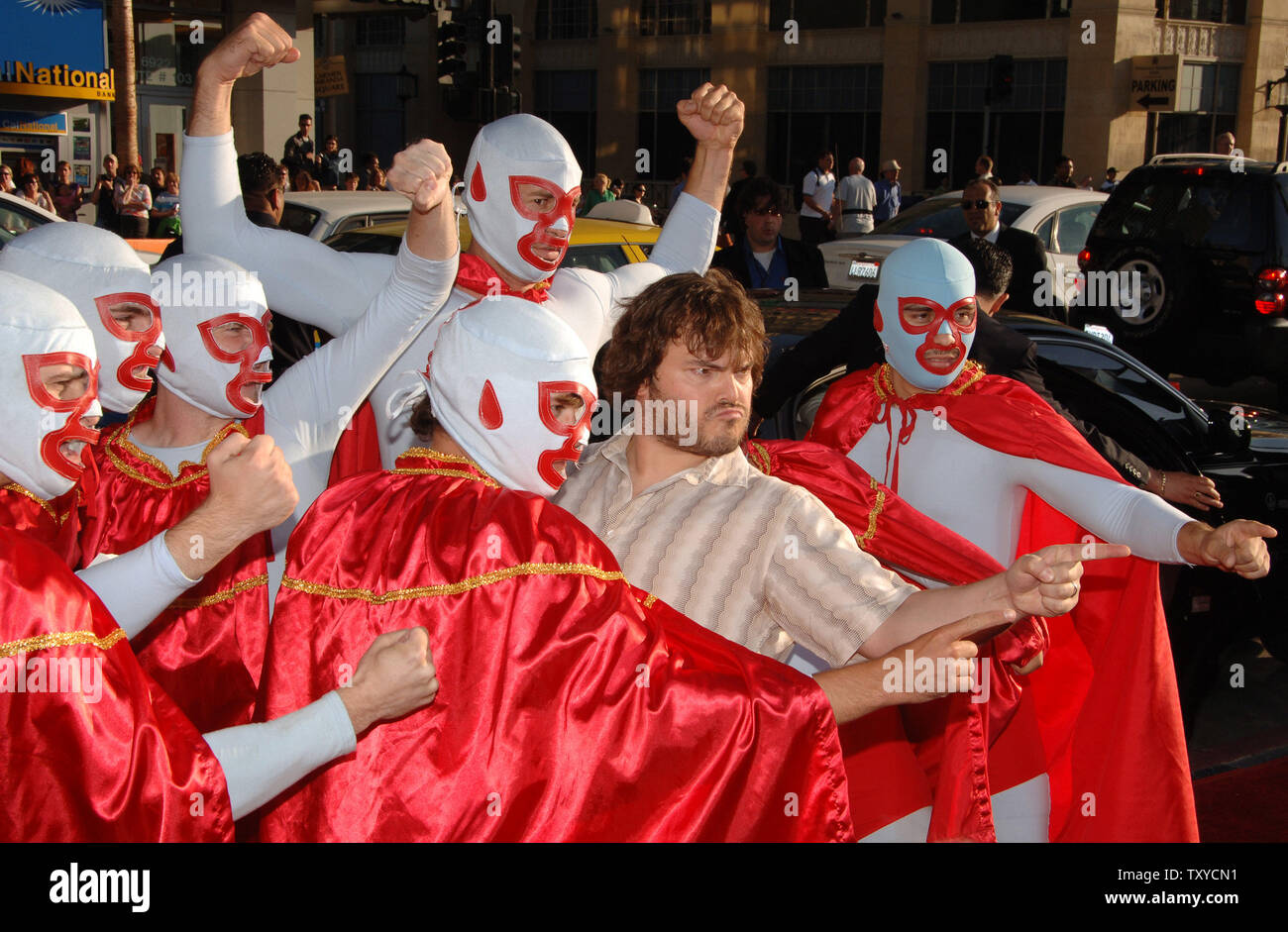 Cast member Jack Black is trailed by actors in Mexican lucha libre ...