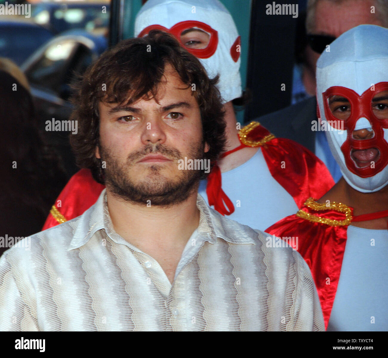 Cast member Jack Black is trailed by actors in Mexican lucha libre ...