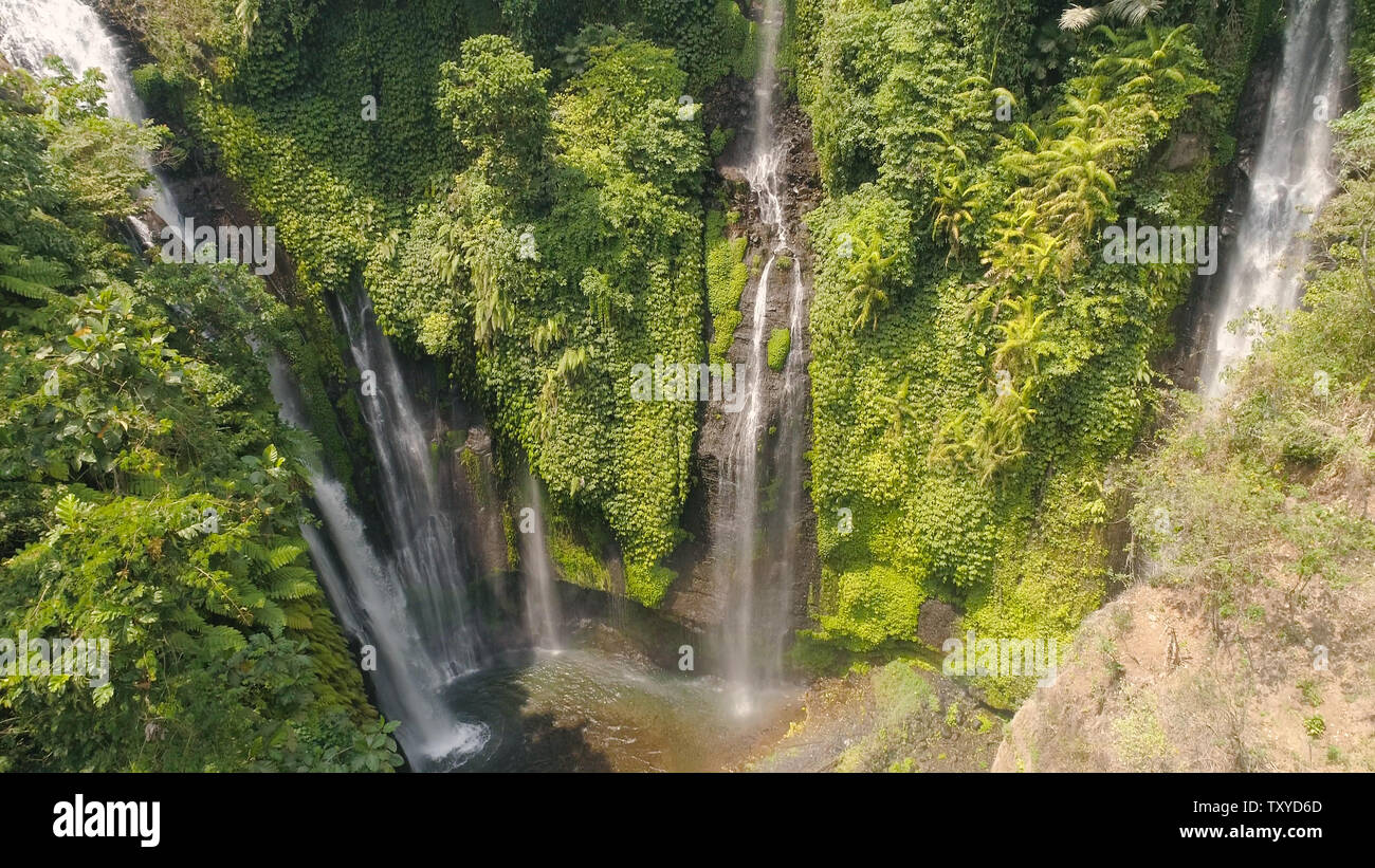 waterfall in green rainforest. Aerial view triple tropical waterfall ...
