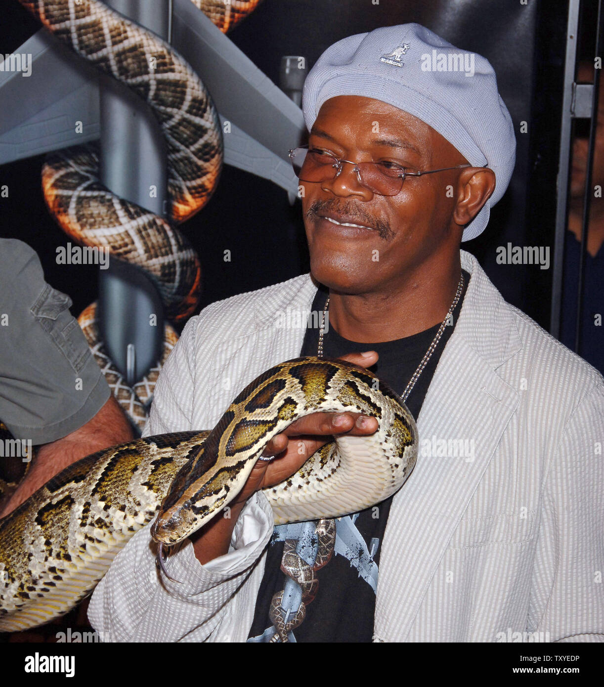 Cast member Samuel L. Jackson handles Kitty Jr., a Burmese python, at ...