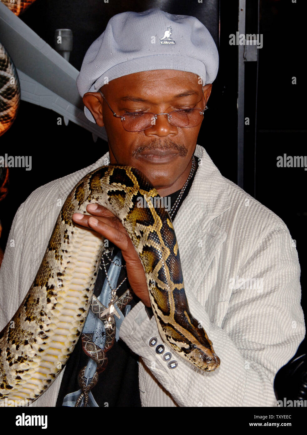 Cast member Samuel L. Jackson handles Kitty Jr., a Burmese python, at ...