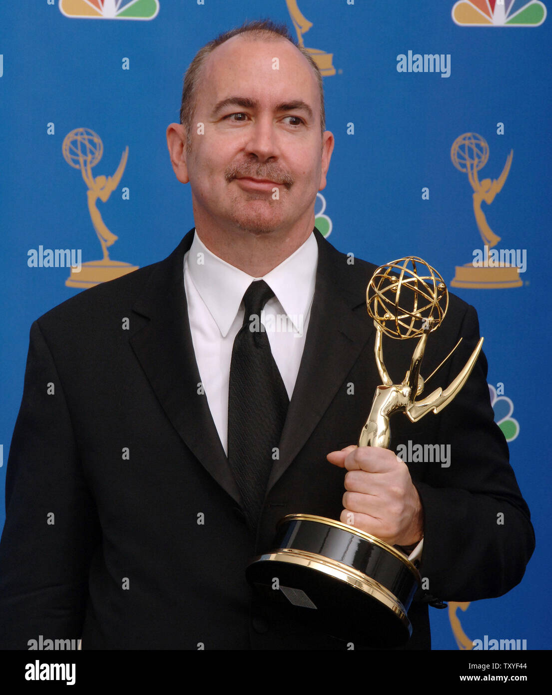 Terence Winter appears backstage with the award he won for outstanding ...