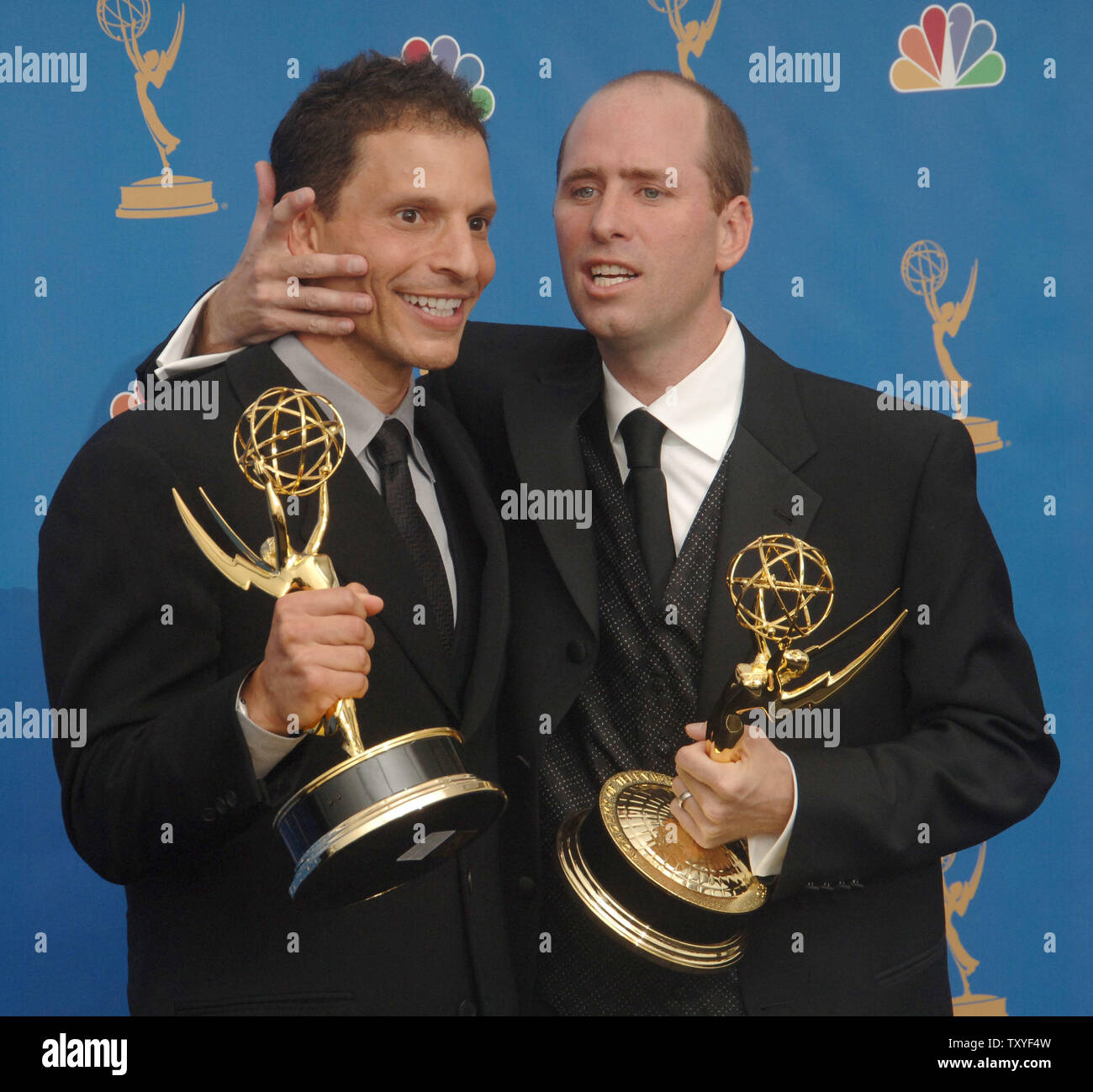 Marc Buckland and Greg Garcia hold their Emmy awards for work on "My ...