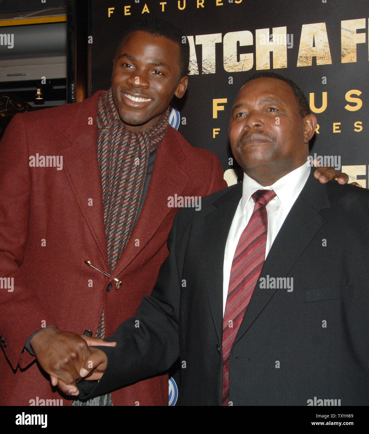 Cast member Derek Luke (L) smiles with Patrick Chamusso during the ...