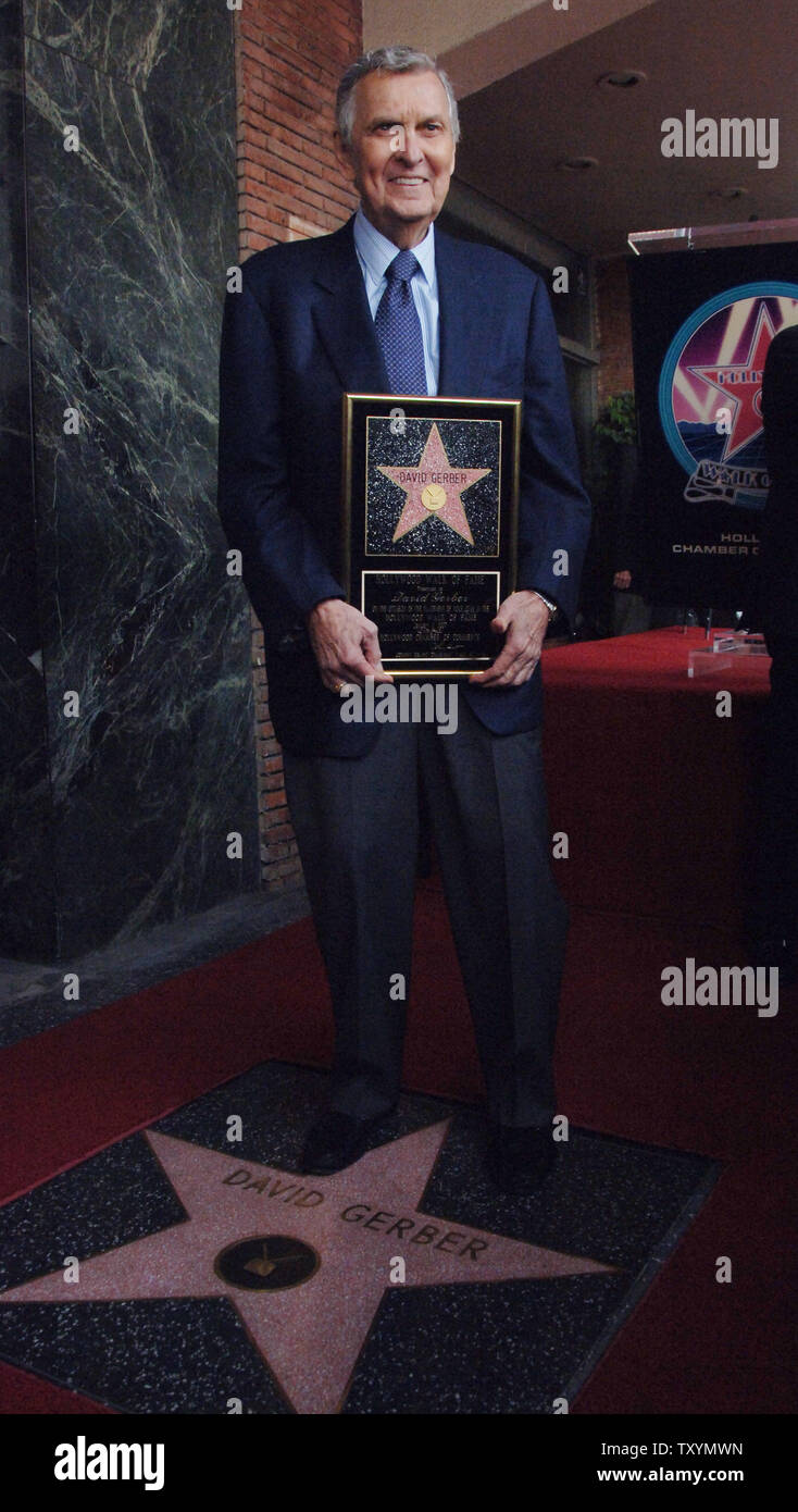David Gerber, an Emmy and Peabody Award winner, holds a replica plaque ...