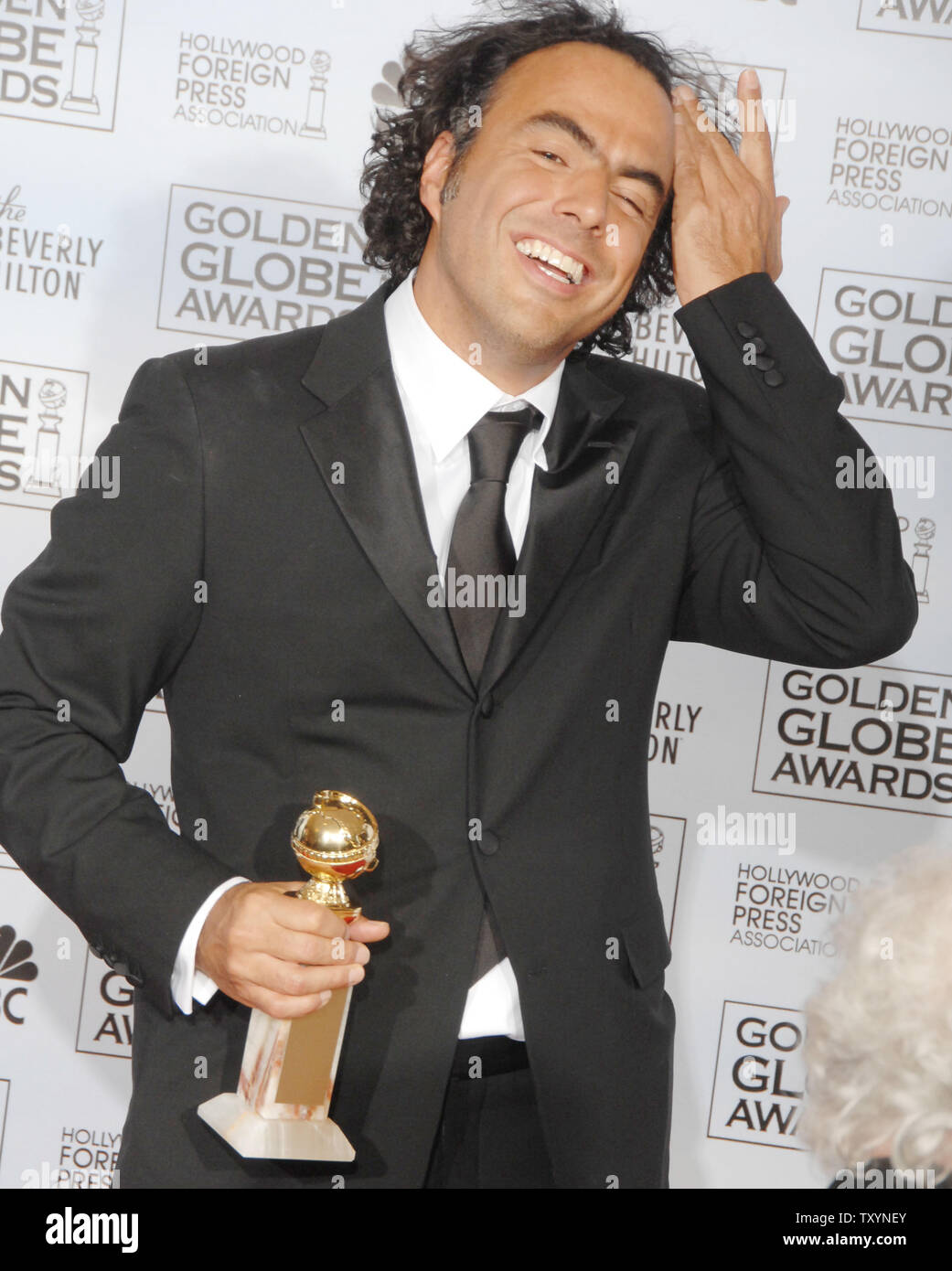 Alejandro Gonzalez appears backstage with his award he won at the 64th ...