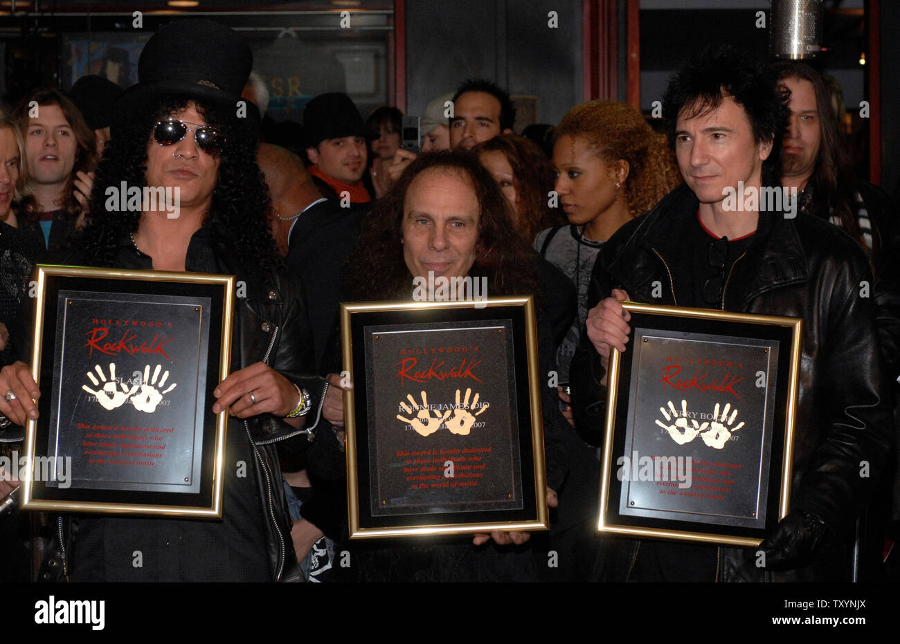 Slash (L-R), Ronnie James Dio, and Terry Bozzio are inducted into ...
