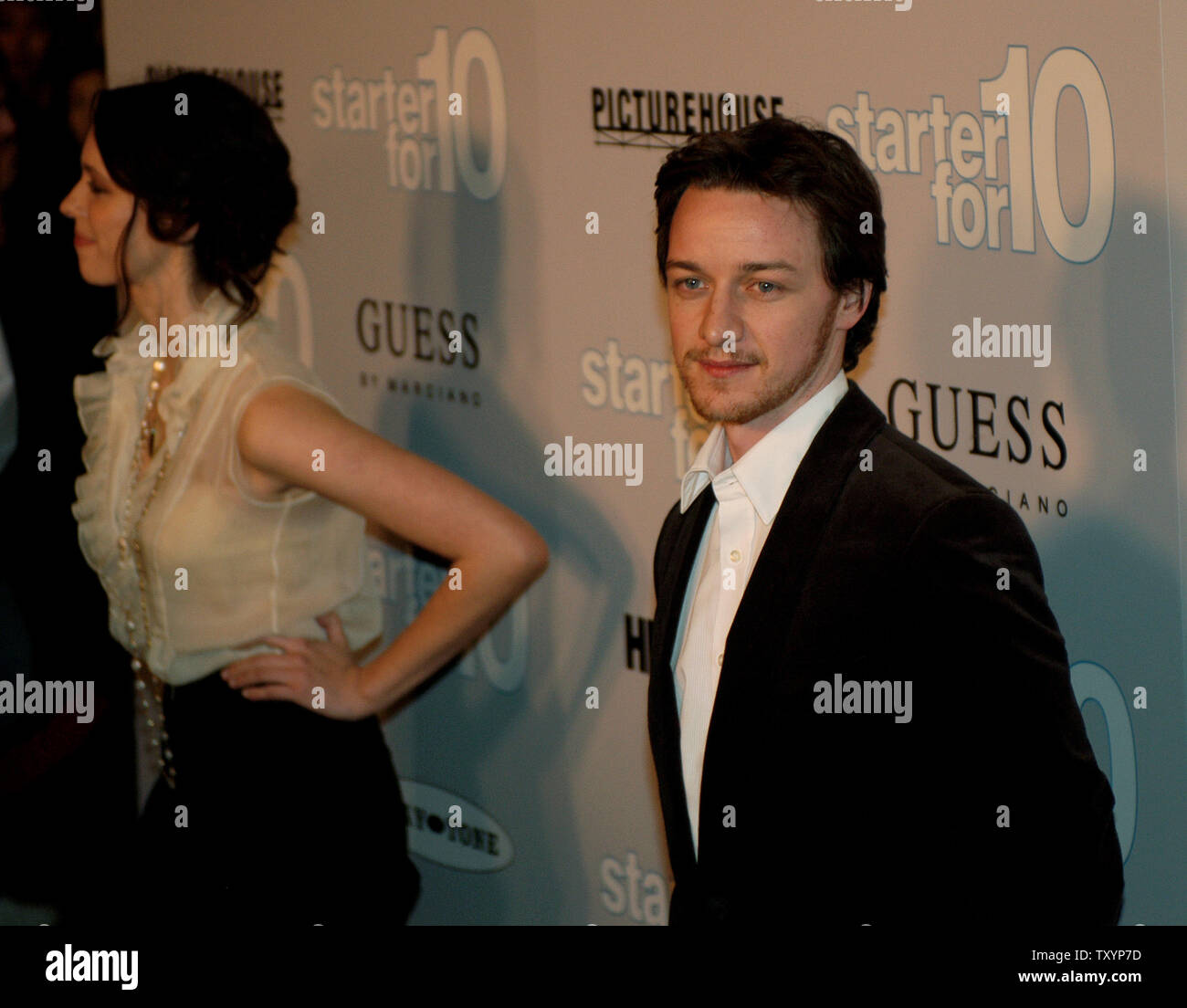 Actor James McAvoy smiles for photographers as co-star Rebecca Hall ...
