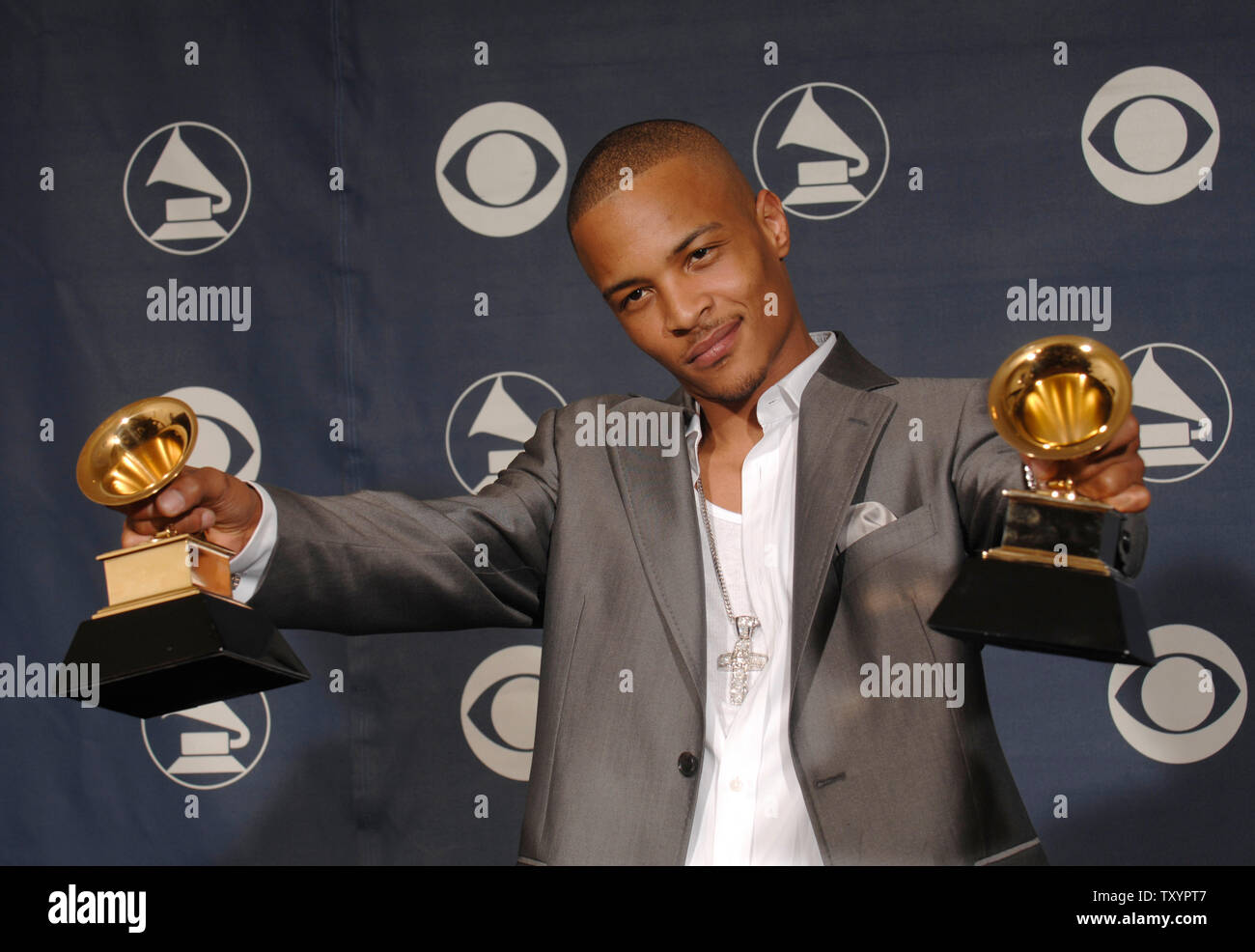 T.I. displays his Grammys for best rap solo performance and for best ...