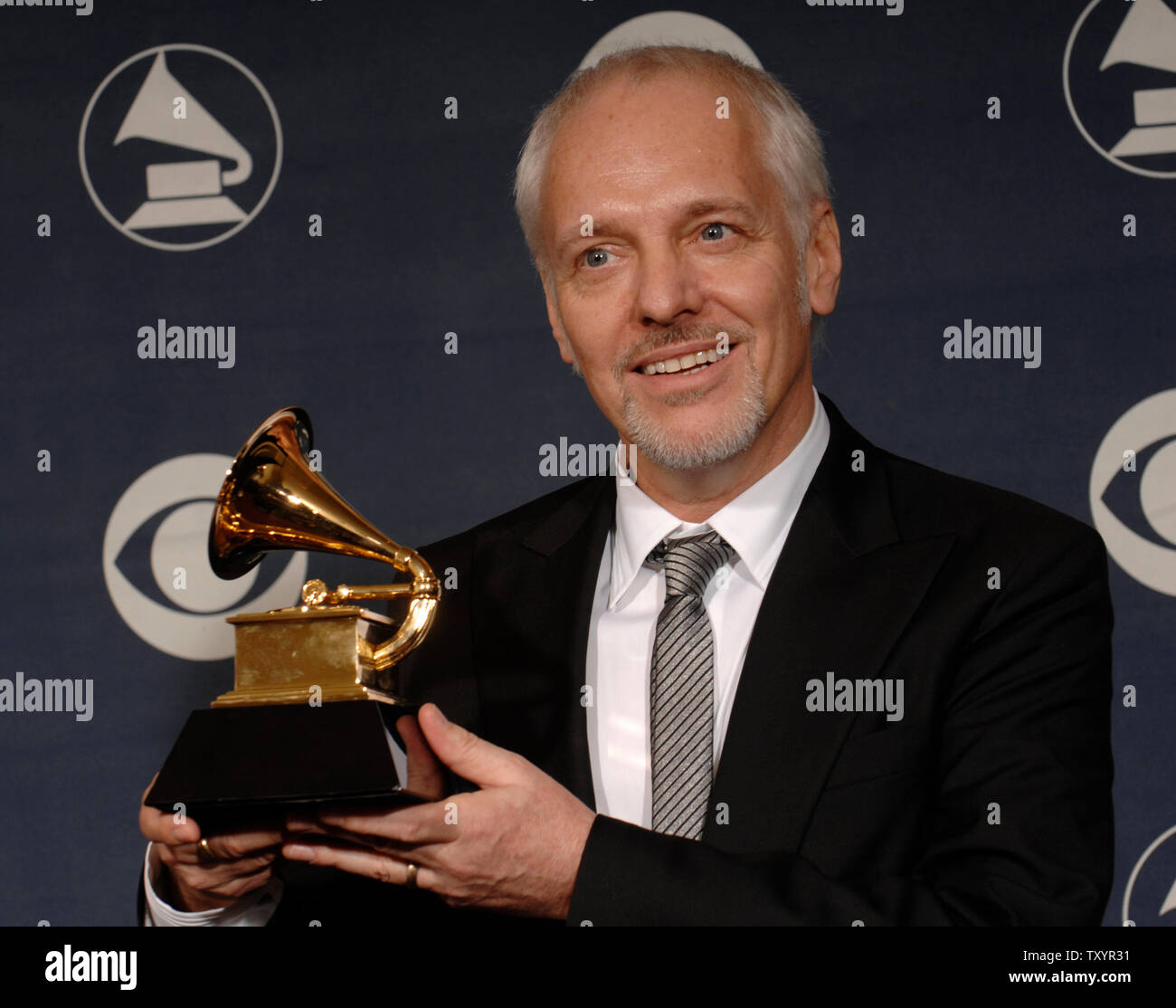 Peter Frampton holds the Grammy he won at the 49th annual Grammy Awards ...