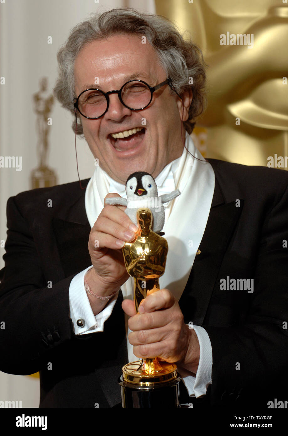 George Miller poses the Oscar he received for the best Animated Feature ...