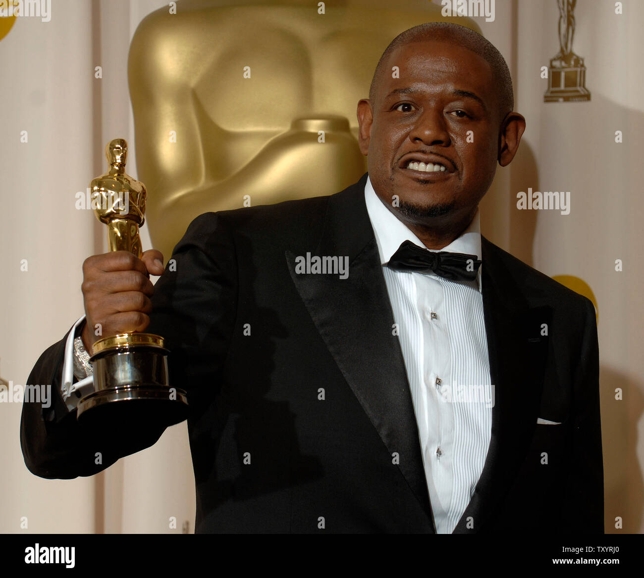 Forrest Whitaker poses for photos after winning the Oscar for Best ...