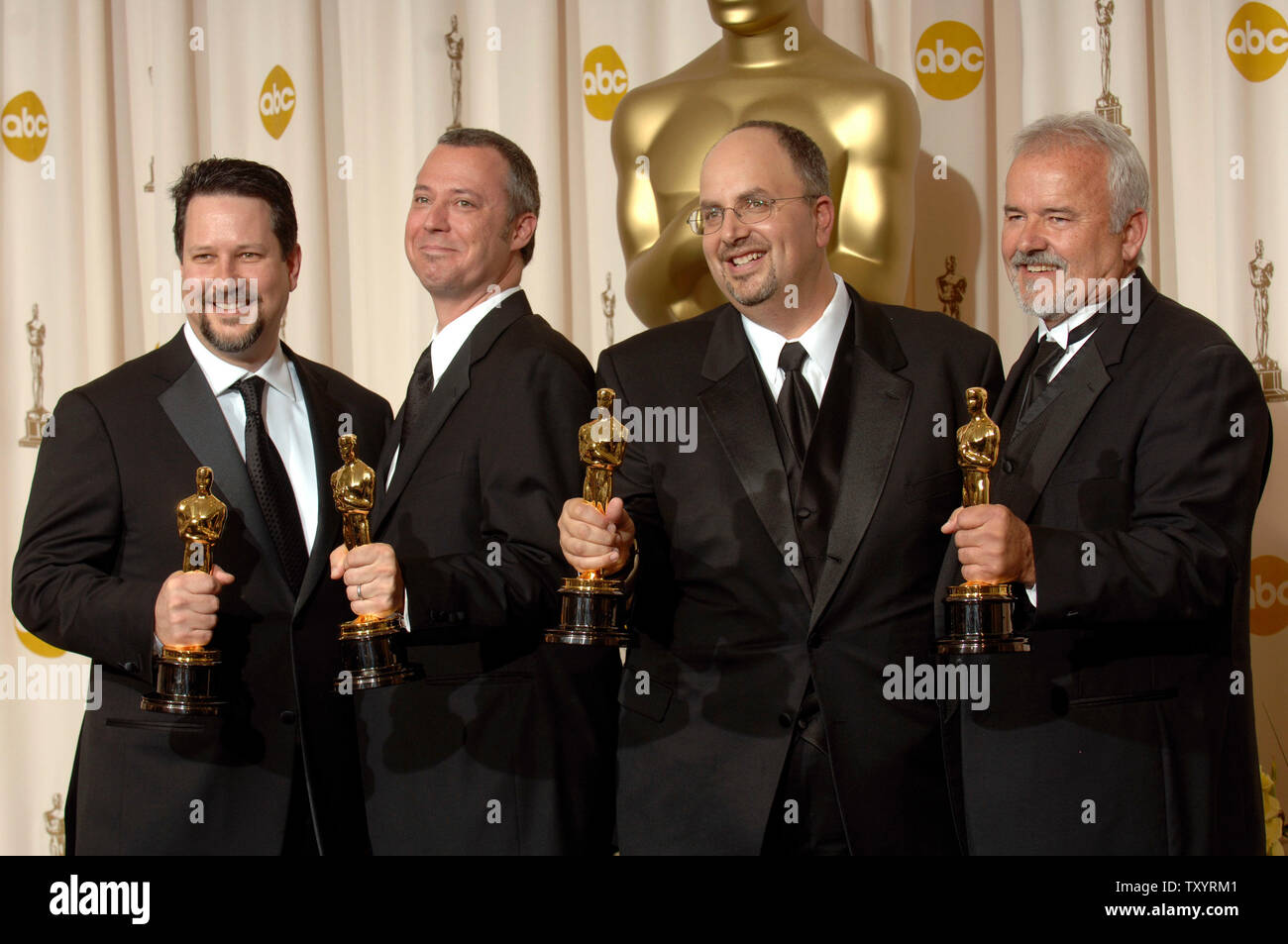 John Knoll, Hal Hickel, Charles Gibson and Allen Hall pose for photos ...