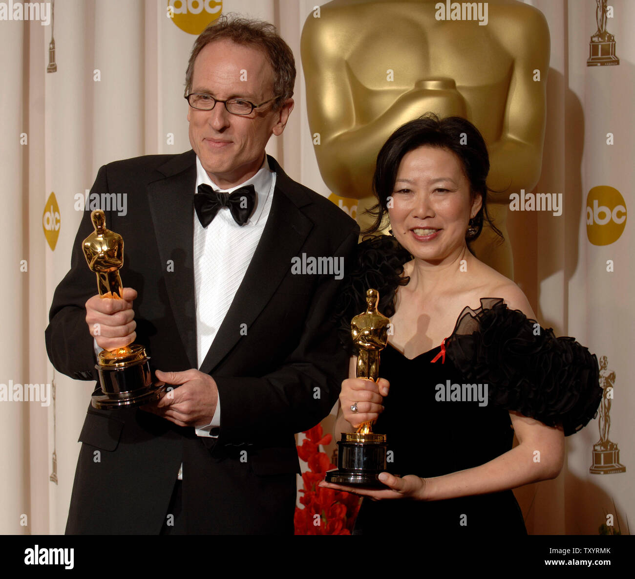 Ruby Yang and Thomas Lennon pose for photos after winning the Oscar for ...
