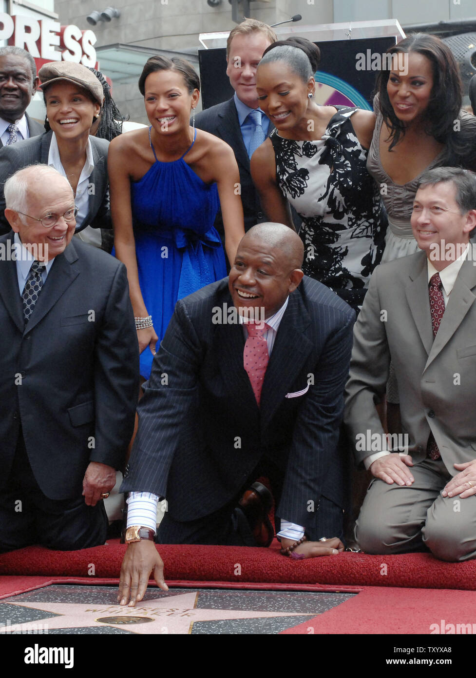 Oscar-winning actor Forest Whitaker, center, smiles at the unveiling of ...