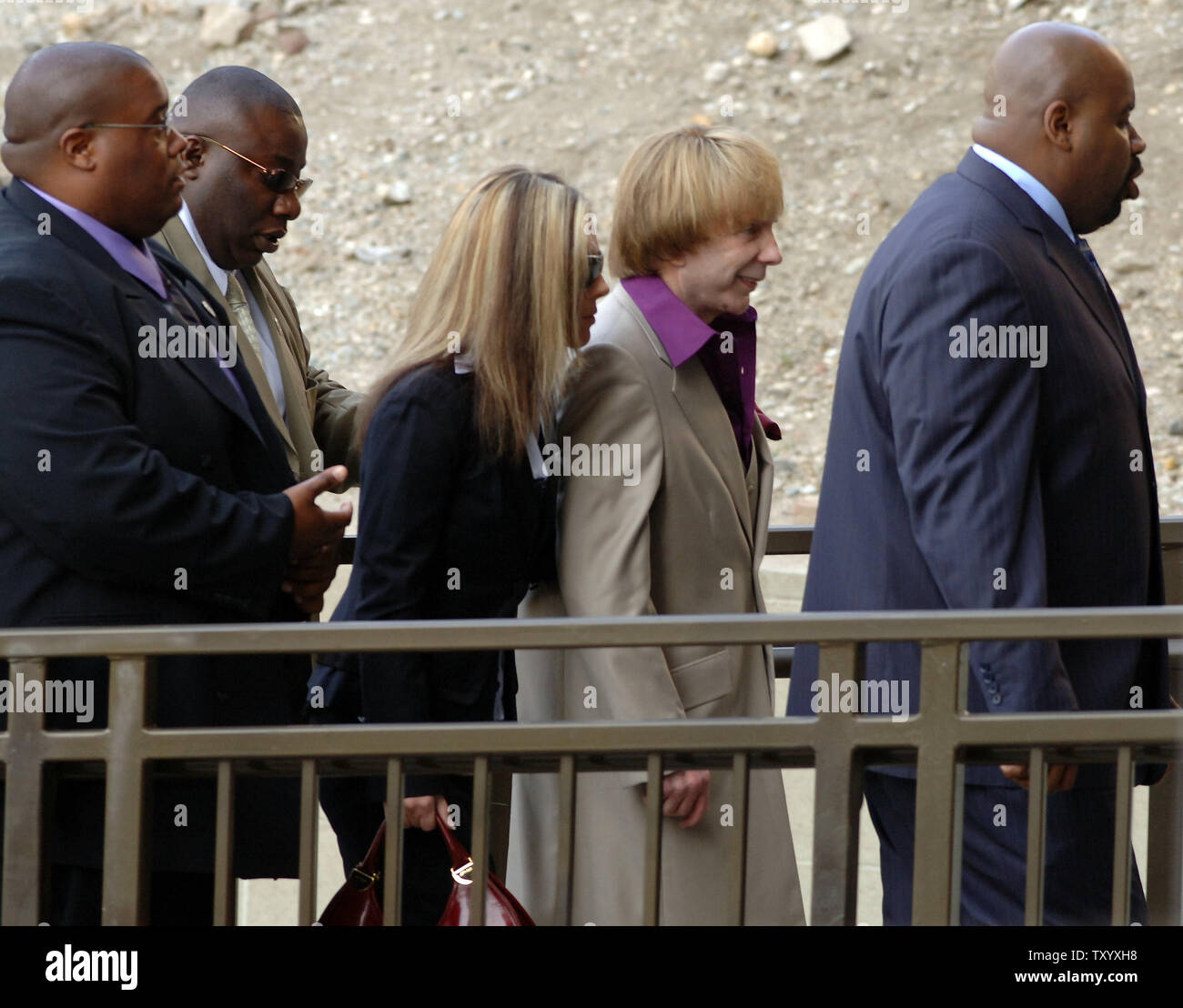 Music producer Phil Spector (C), accompanied by his wife, Rachelle ...