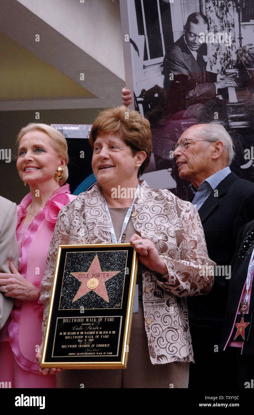 Family member Joey Cole Kubesh holds a replica plaque during an ...