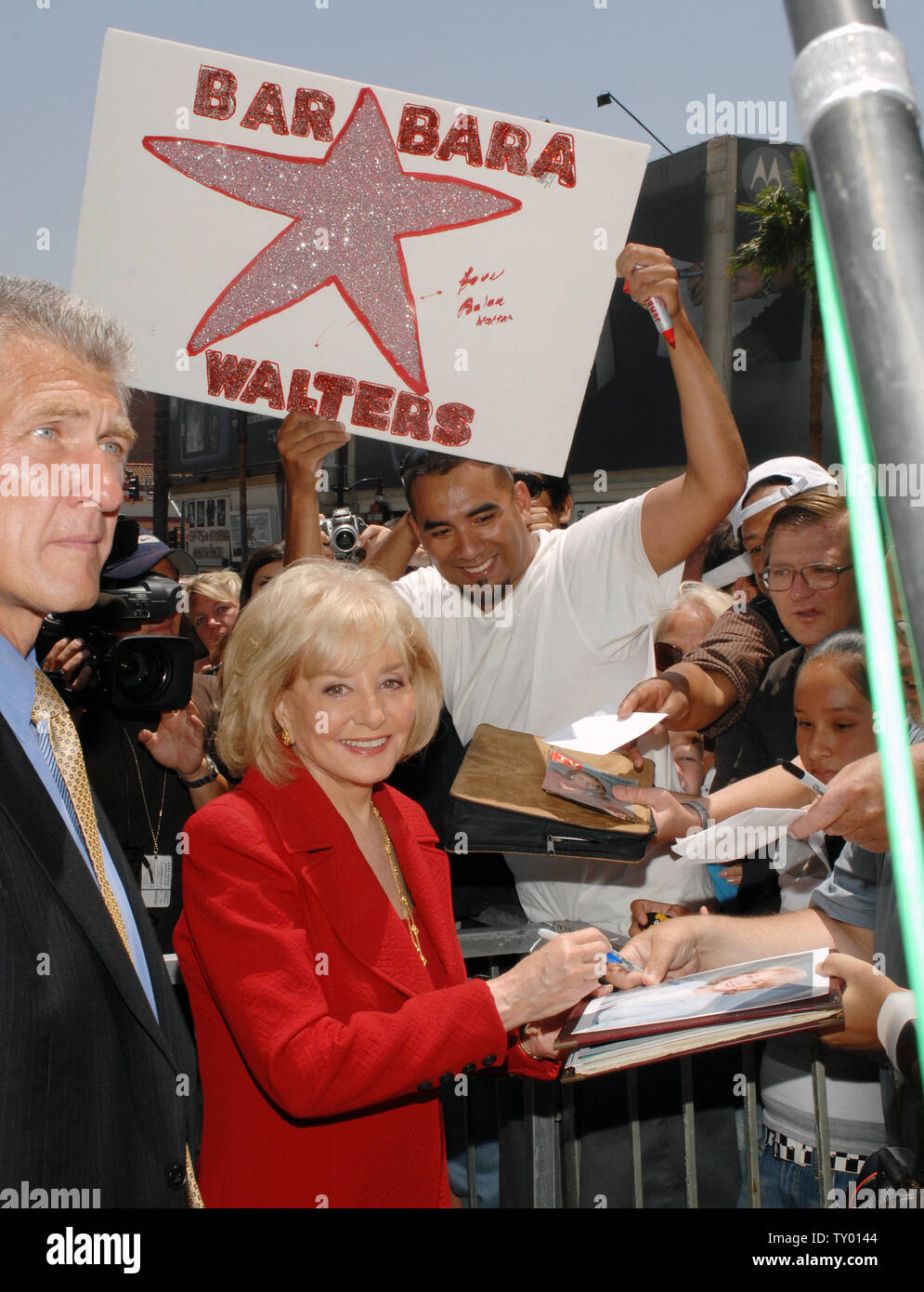 ABC talk show host and newswoman Barbara Walters signs autographs ...