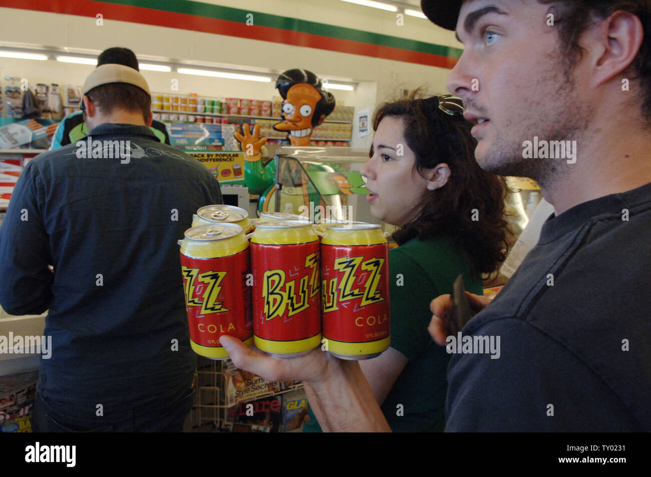 Customers wait in line to purchase specialty products at a 7-Eleven ...