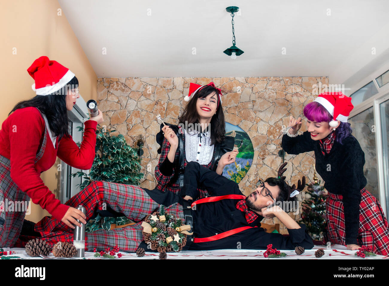 group of friends celebrating christmas spirit having fun with man Stock ...