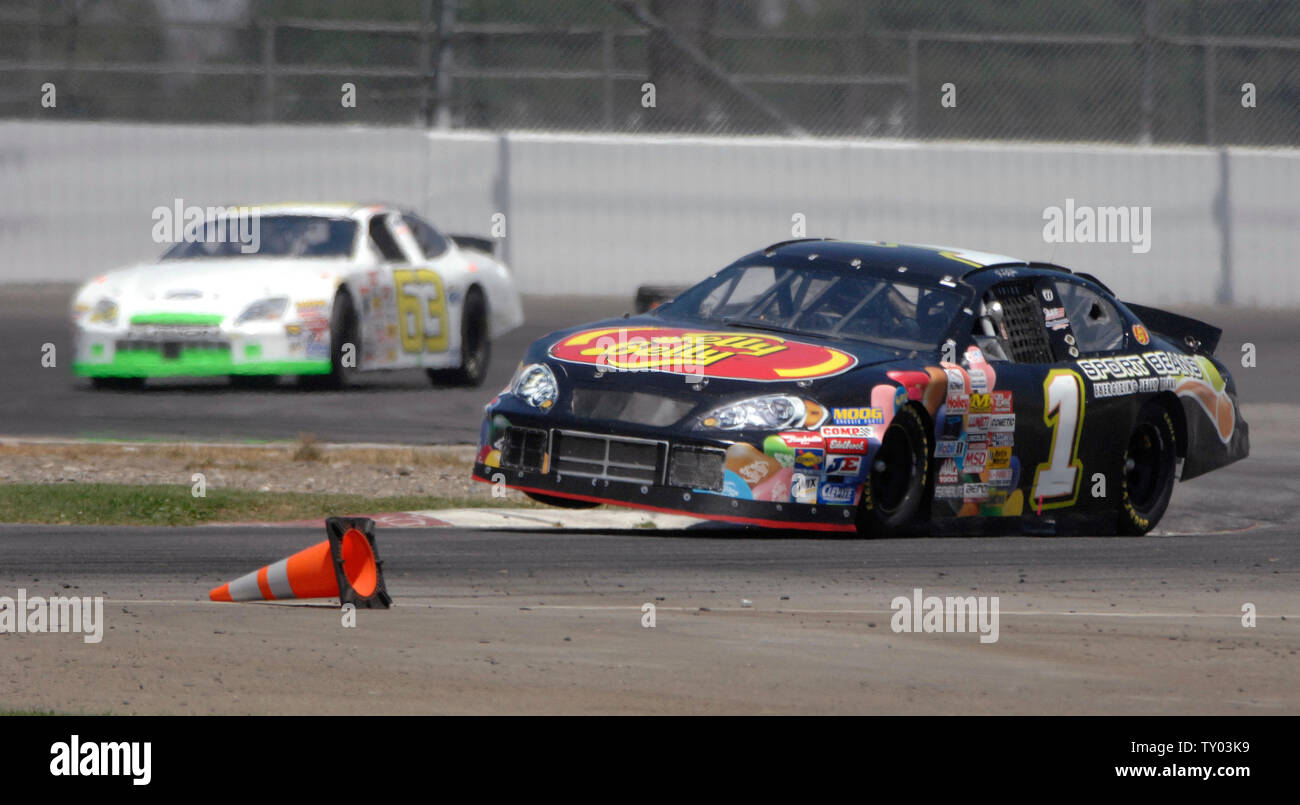 Drivers Jim Inglebright (R) and Lloyd Mack (L) run practice laps before ...