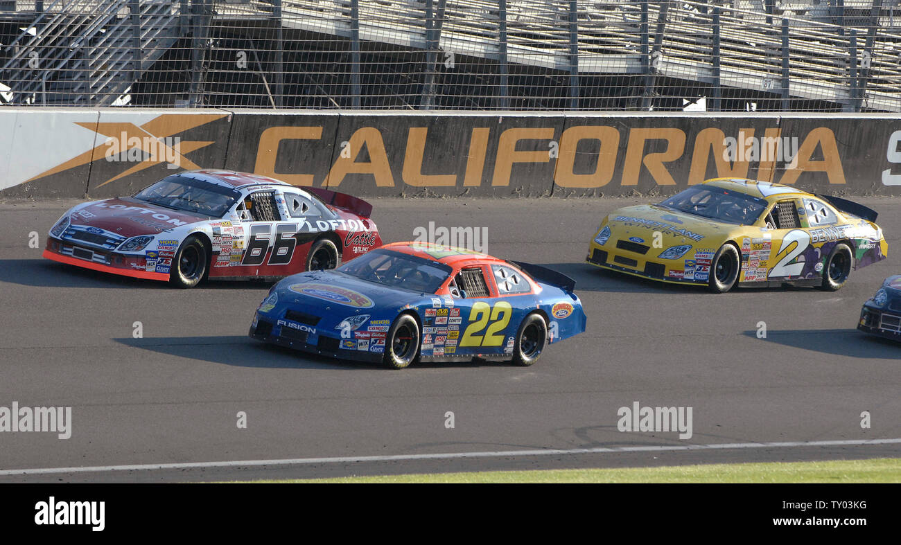 Drivers follow the pace car at the start of the NASCAR Grand National ...