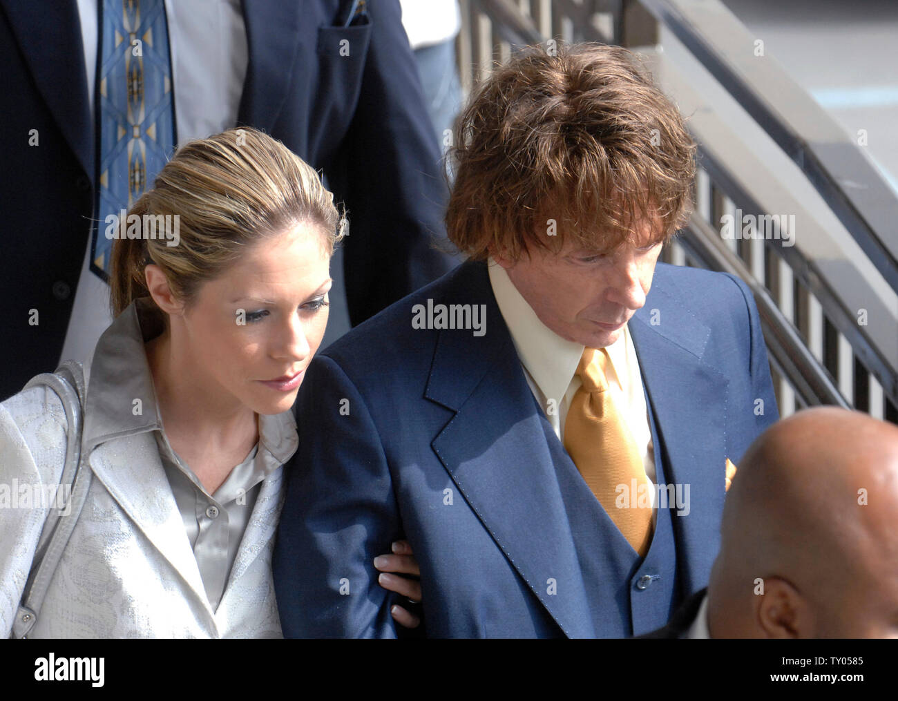 Phil Spector (R) leaves with wife Rachelle Spector and unidentified ...