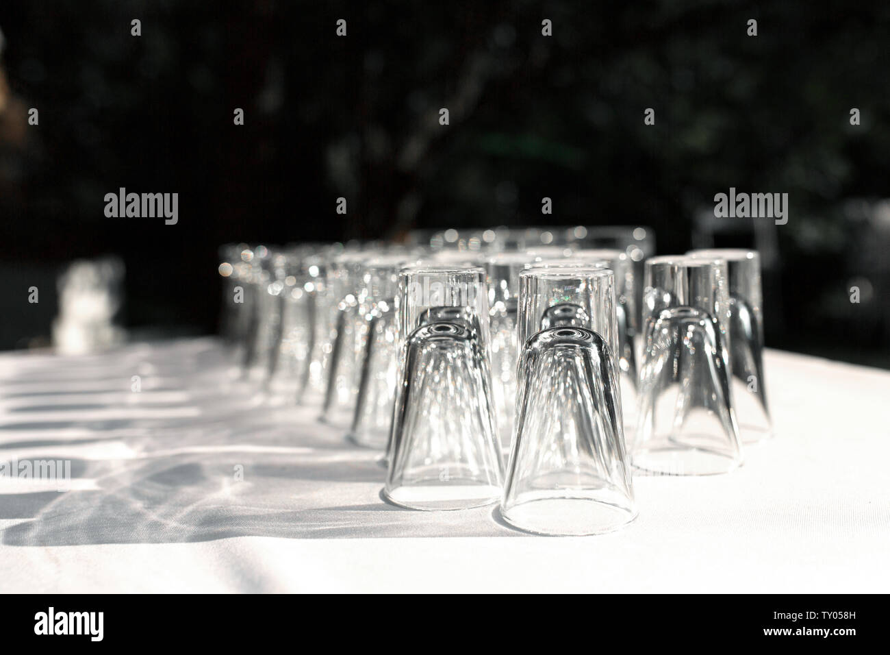 Many empty clean glasses for guests at the buffet festive wedding table ...