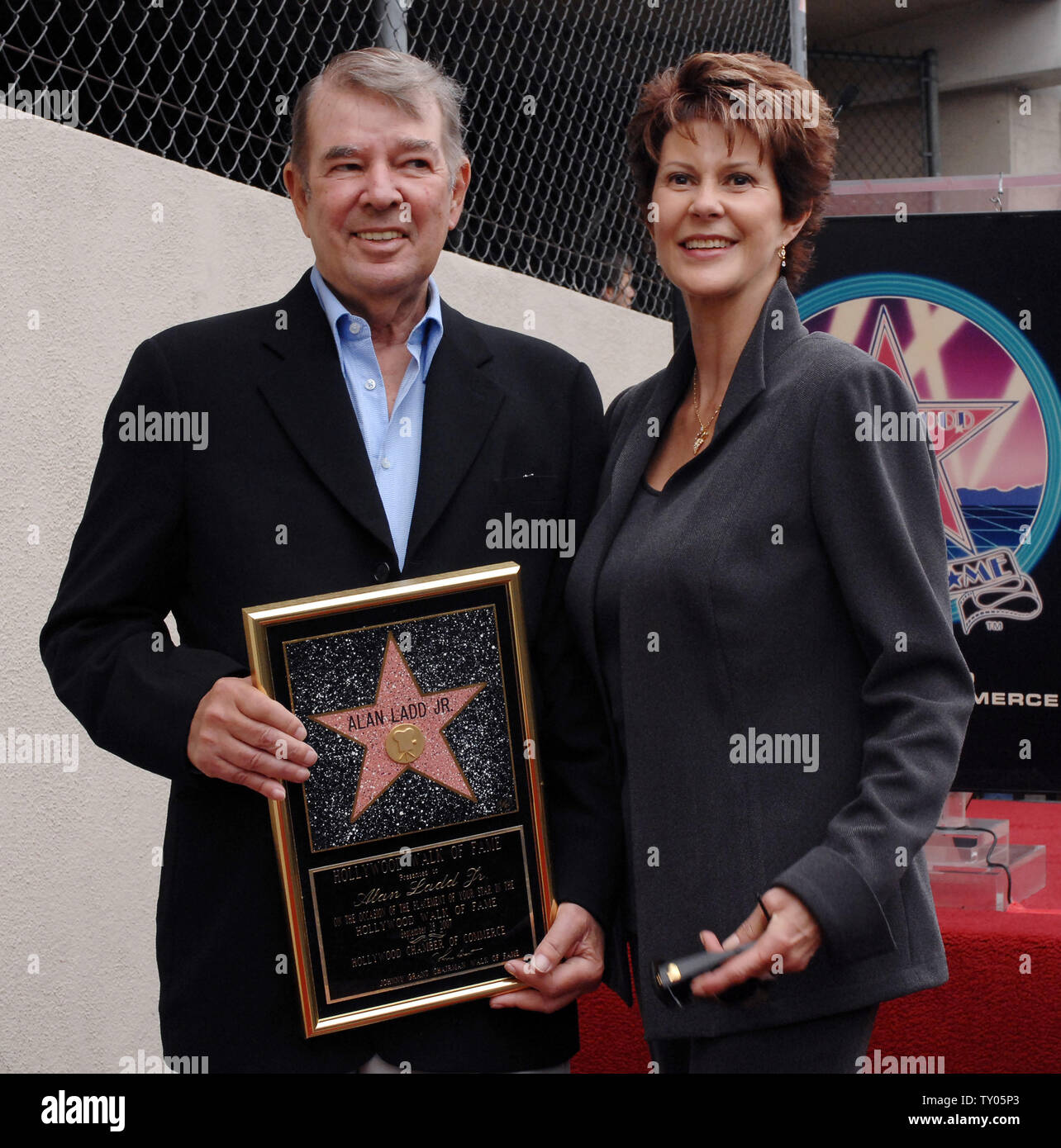 Producer Alan Ladd Jr. holds a replica plaque after he was honored with ...