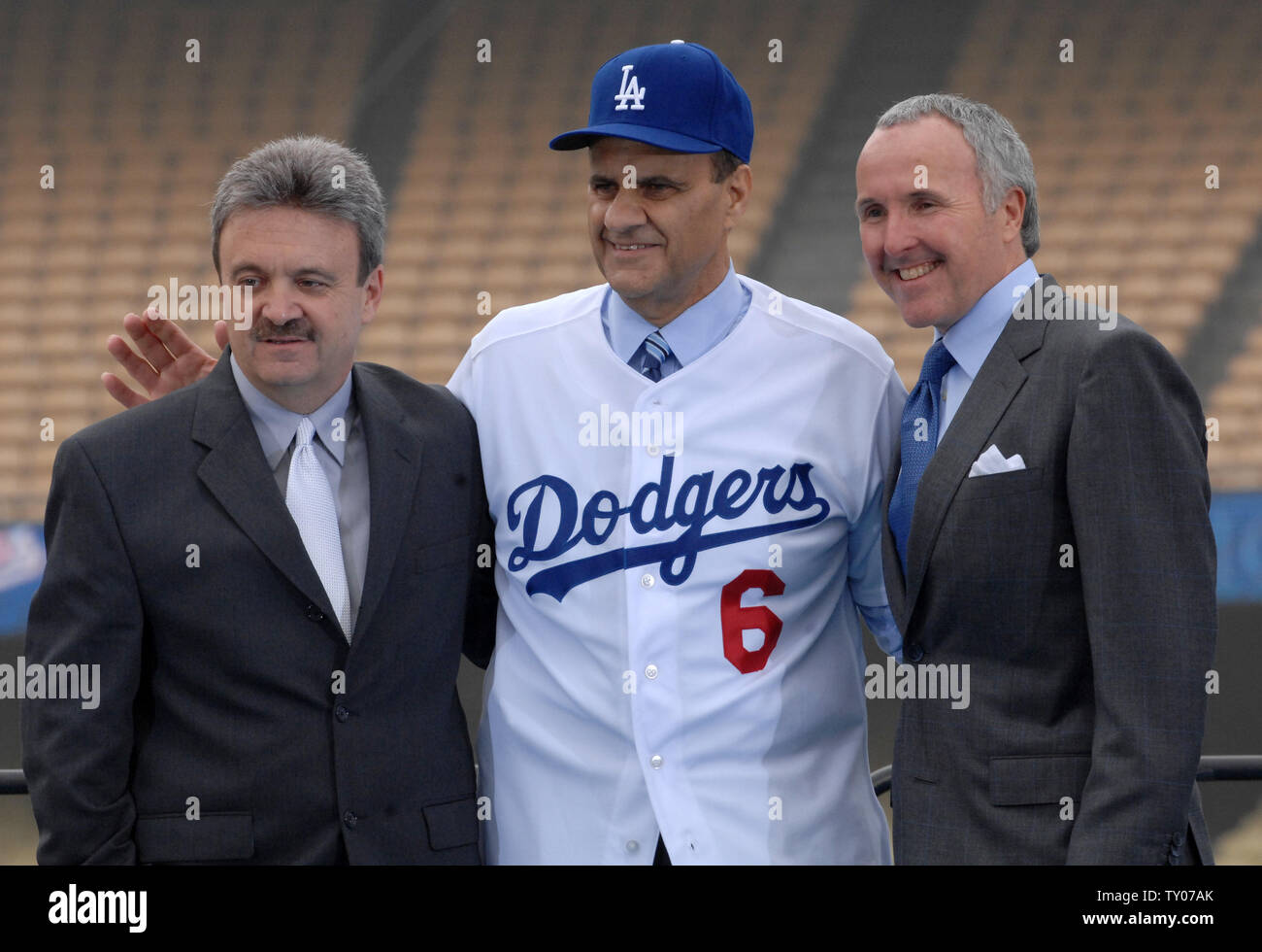 Los Angeles Dodgers owner Frank McCourt (R) and General Manager Ned ...
