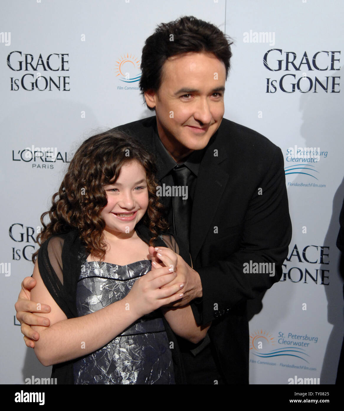 Gracie Bednarczyk (L) and John Cusack, cast members in the motion ...