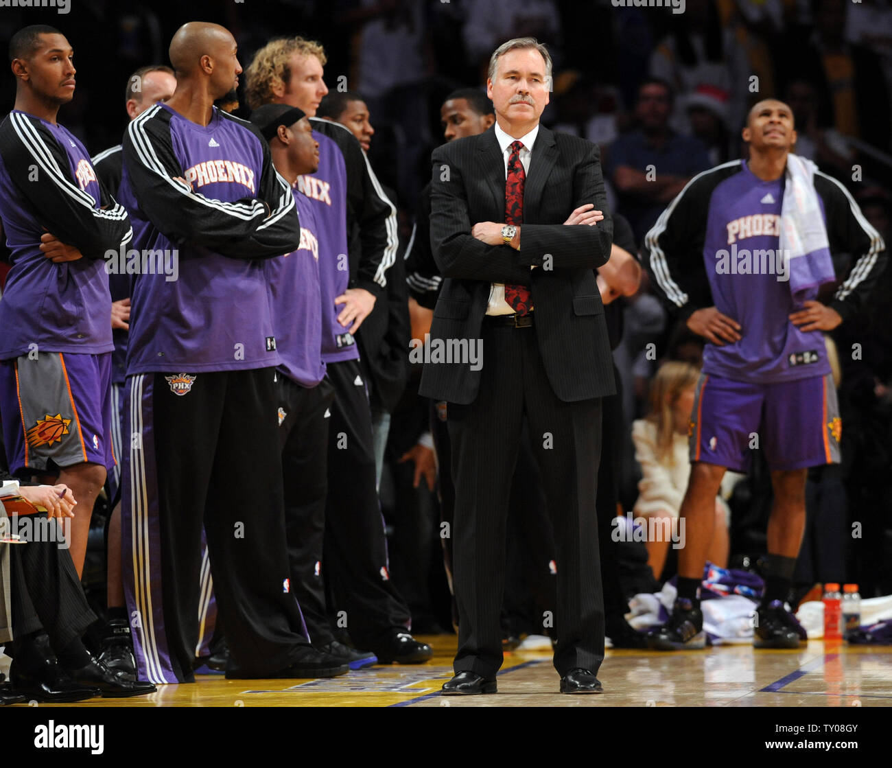 Phoenix Suns head coach Mike D'Antoni looks on as his team goes on to ...