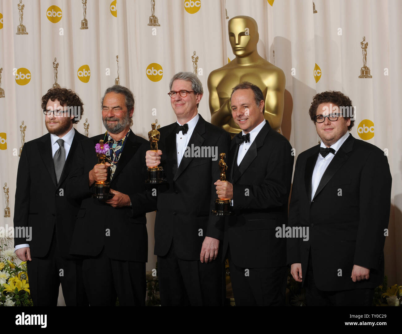 Presenters Seth Rogen (L) and Jonah Hill (R) pose with Scott Millan ...