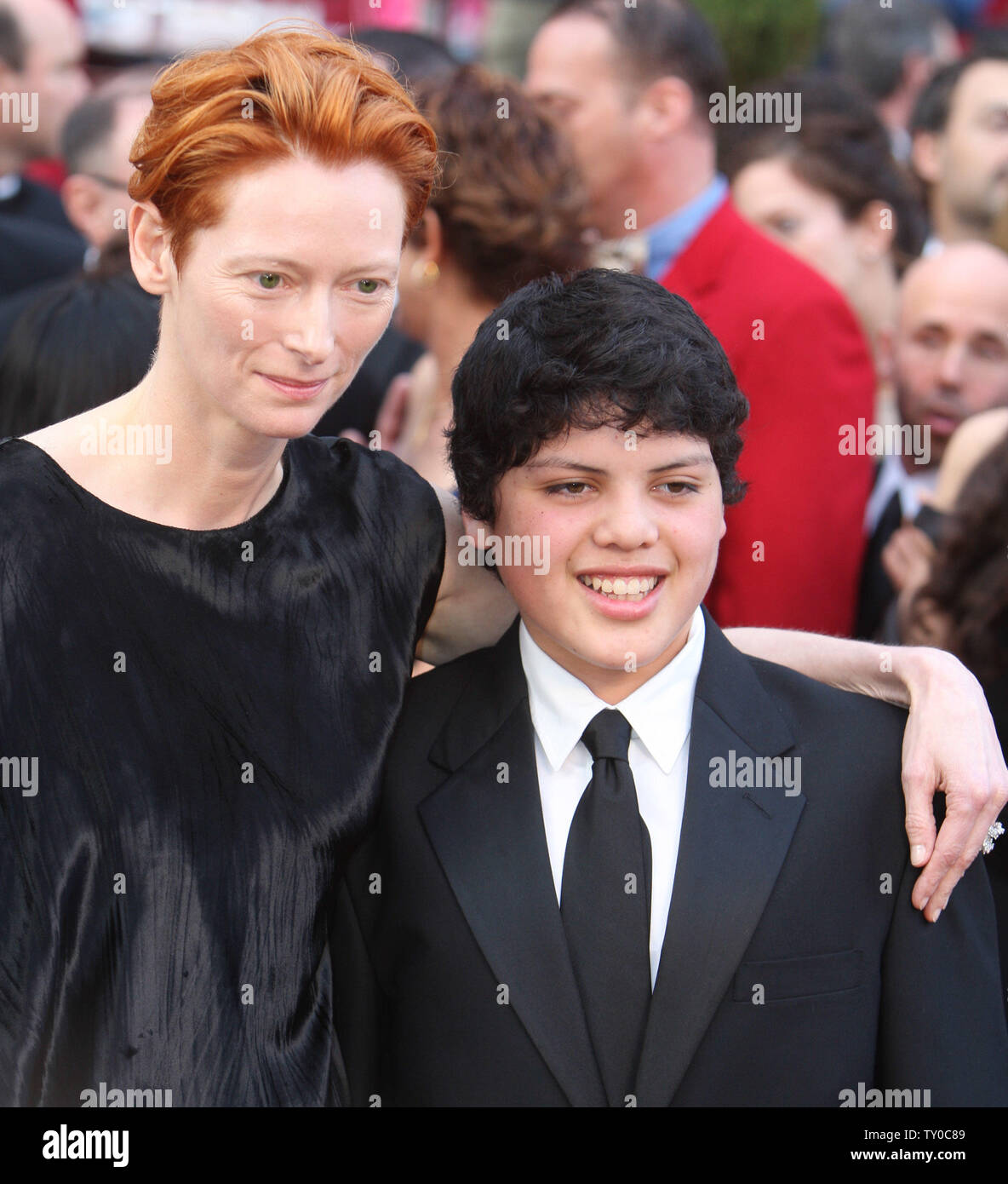 Actress Tilda Swinton (L) and her guest arrive at the 80th Annual ...