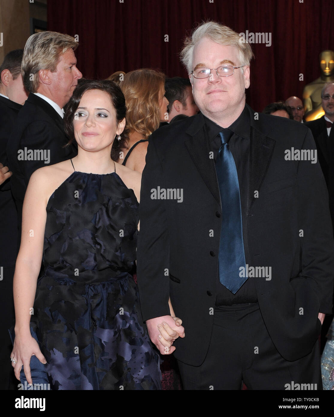 Philip Seymour Hoffman (R) and Mimi O'Donnell arrive at the 80th ...