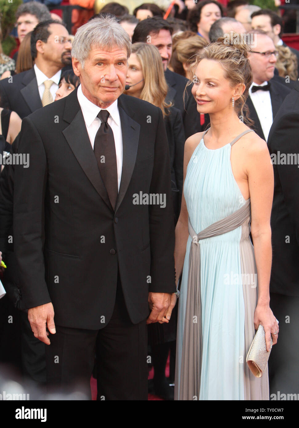 Harrison Ford (L) and actress Calista Flockhart arrive for the 80th ...
