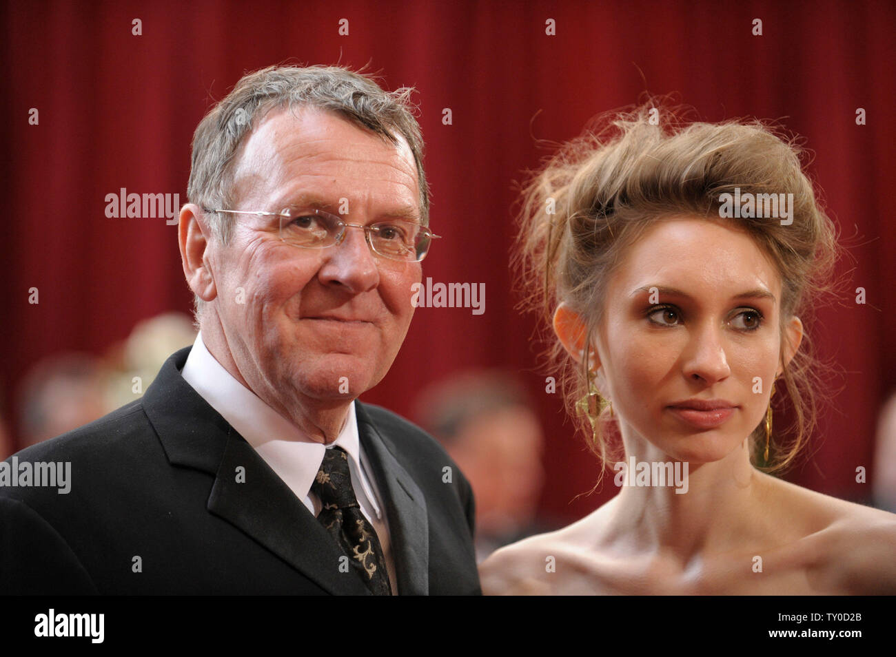 British actor Tom Wilkinson and his guest arrive for the 80th Annual ...